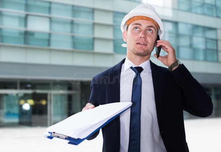 Foreman in Suit and Hat with Folder is Taking Document Case and ...
