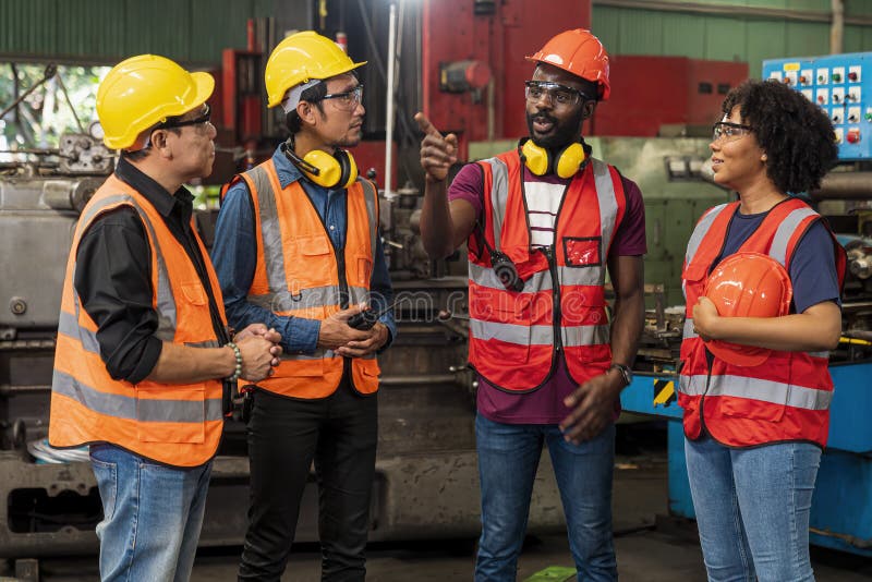 Foreman is Taking Orders in the Factory. Factory Worker and Engineer As ...