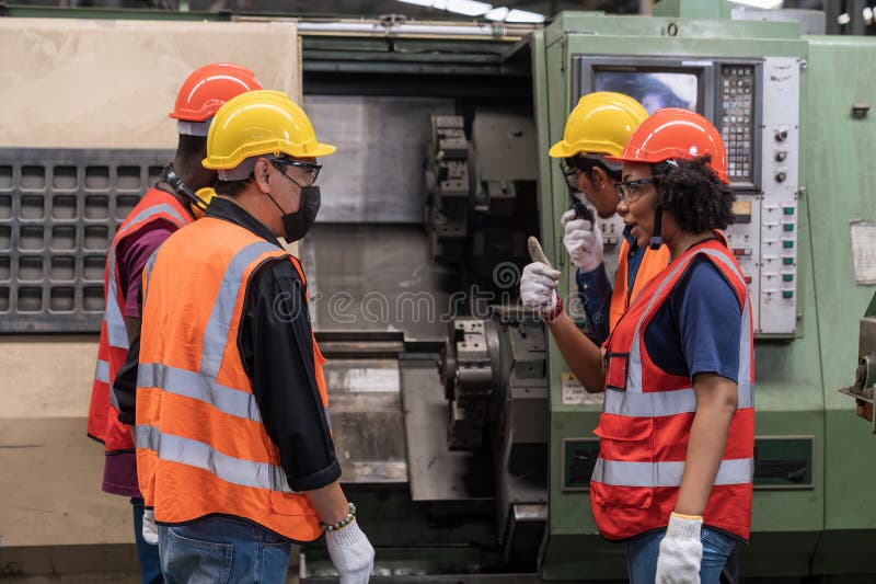 Foreman is Taking Orders in the Factory. Factory Worker and Engineer As ...