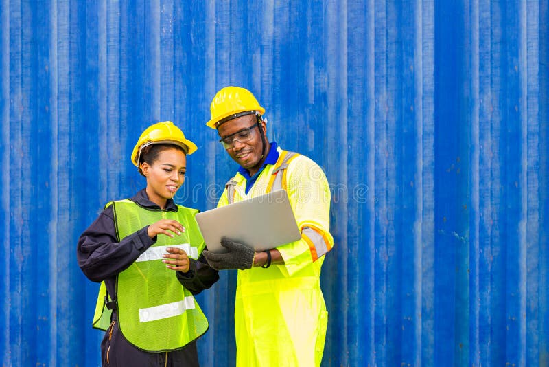 Foreman Using Laptop Computer in the Port of Loading Goods. Foreman ...