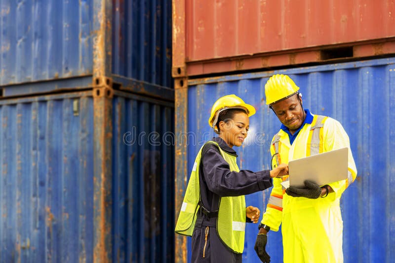 Foreman Using Laptop Computer in the Port of Loading Goods. Foreman ...
