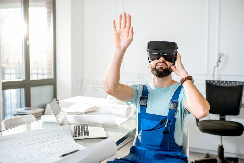 Foreman Using Vr Glasses To Imagine Projected Environment Stock Photo ...