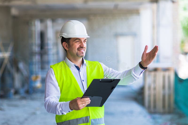 Foreman in Working Uniform Expertising the Structure Standing with ...
