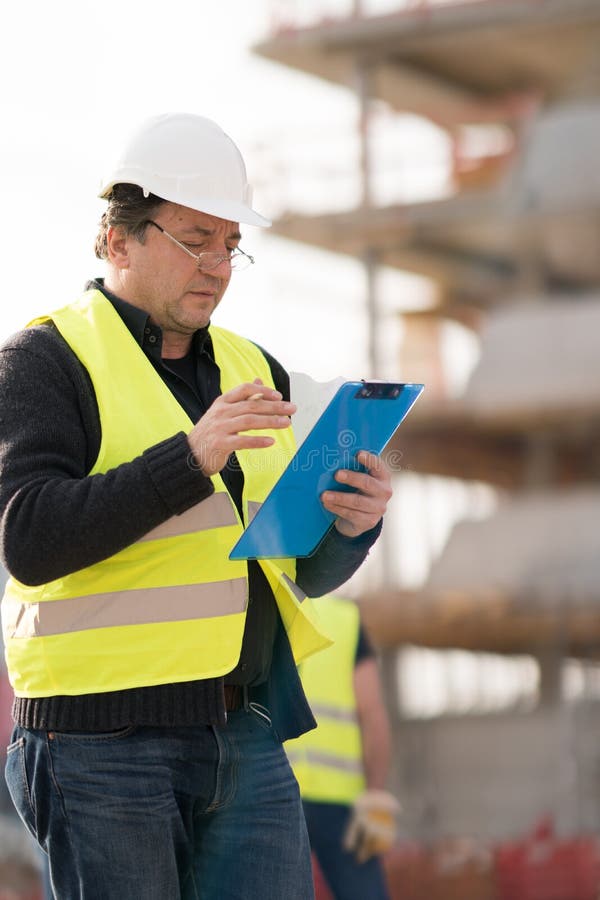Foreman at Work Expertising the Structure on Construction Site with ...