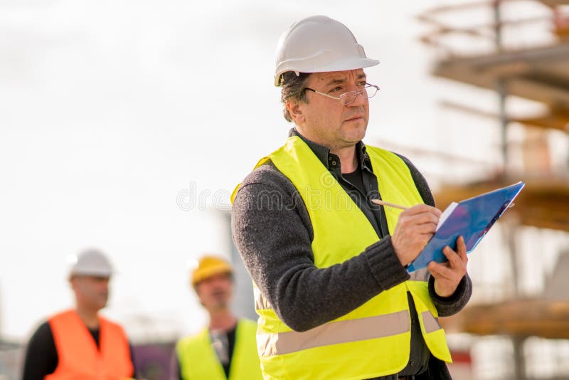 Foreman at Work Expertising the Structure on Construction Site with ...