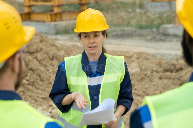 Foreman Working with Workers Outdoors Stock Image - Image of foreman ...