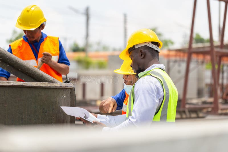 Foreman and Worker Team Discussing at Precast Concrete Factory Site ...