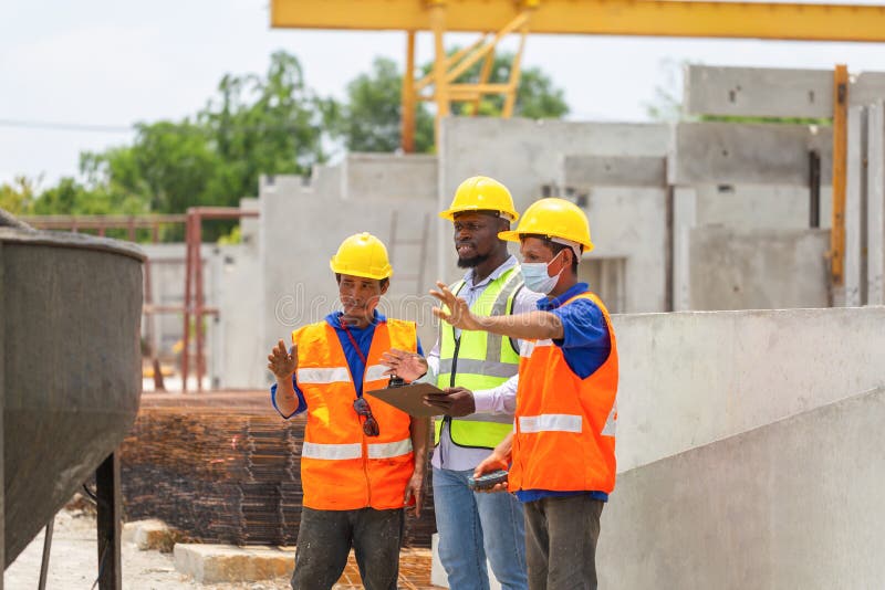 Foreman and Worker Team Discussing at Precast Concrete Factory Site, Construction Workers at ...