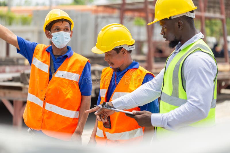 Foreman and Worker Team Discussing at Precast Concrete Factory Site ...