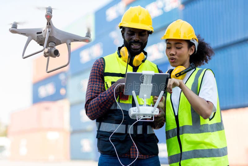 Foreman or Worker Use Remote Controller Piloting Drone at Containers ...