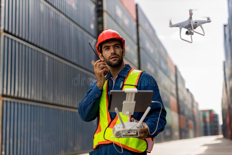 Foreman or Worker Use Remote Controller Piloting Drone at Containers ...