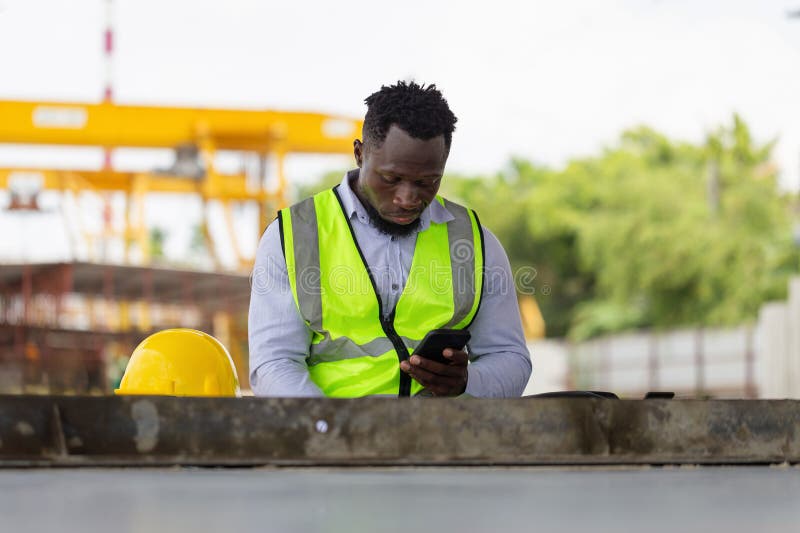 Foreman Worker Using Mobile Smartphone at the Construction Site ...
