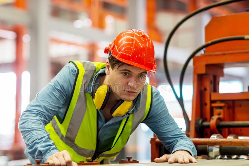 First Aid Support Accident at Work of Worker at Factory. Male Worker ...