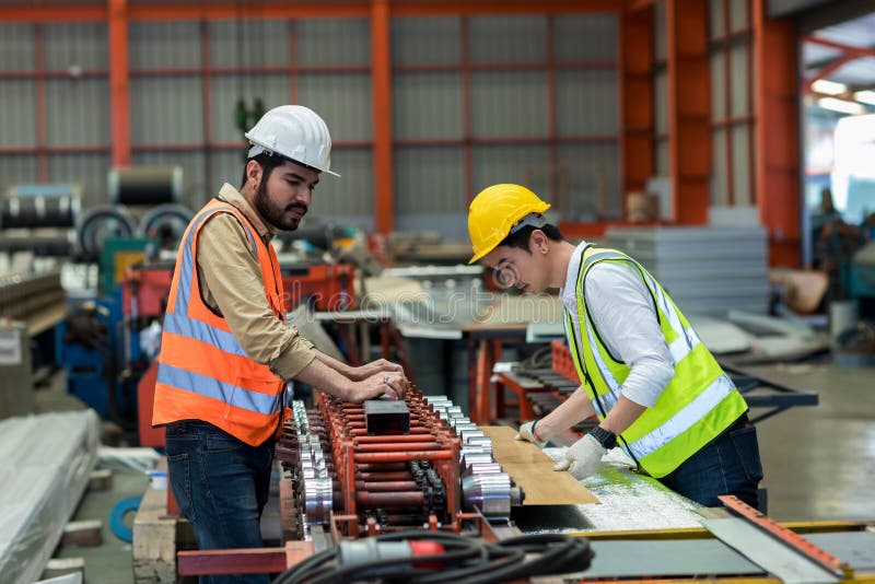 First Aid Support Accident at Work of Worker at Factory. Male Worker ...