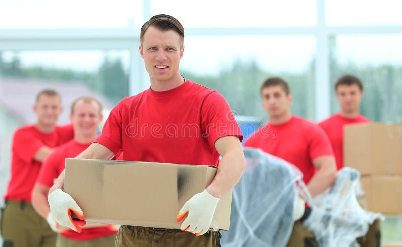 Foreman and Workers with Boxes of Building Materials Stock Image ...