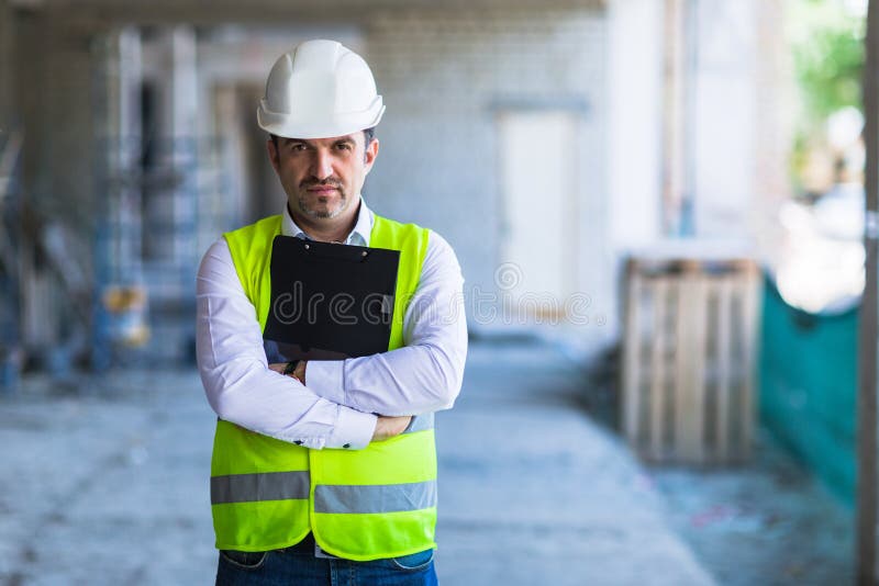 Foreman in Working Uniform Expertising the Structure Standing with ...