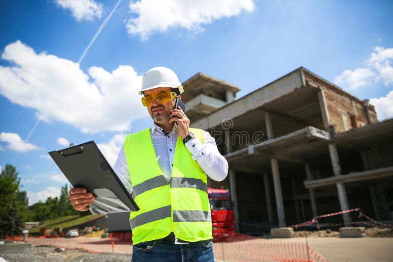 Foreman in Working Uniform Expertising the Structure Standing with ...