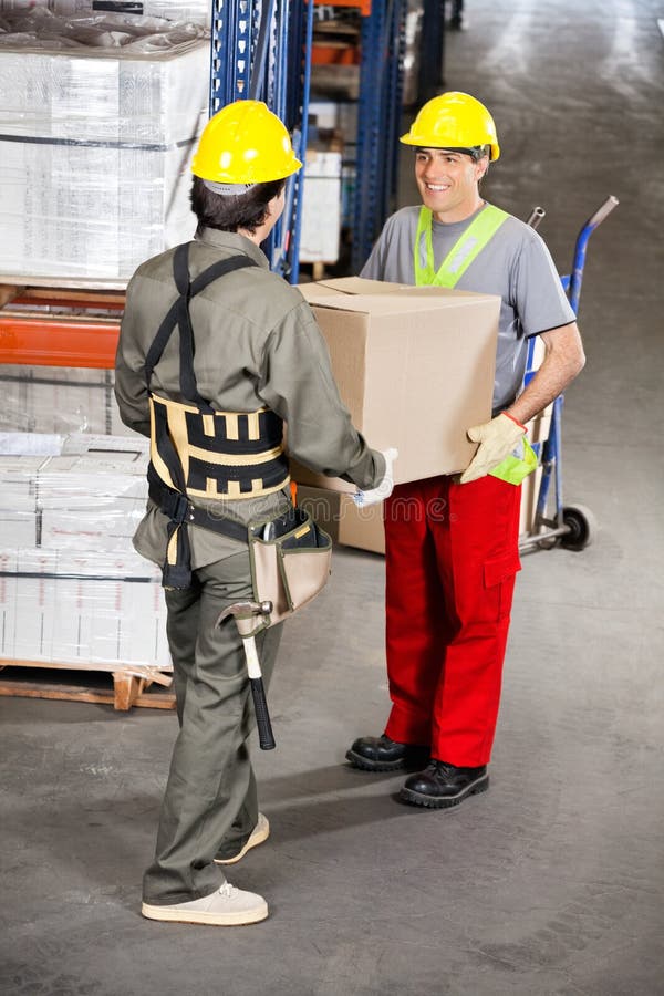 Foremen Lifting Cardboard Box in Warehouse Stock Image - Image of ...
