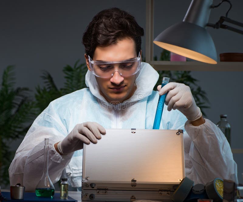 Forensic Investigator Working in Lab Looking for Evidence Stock Image ...