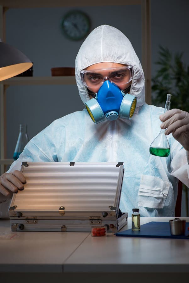 The Forensic Investigator Working in Lab Looking for Evidence Stock ...
