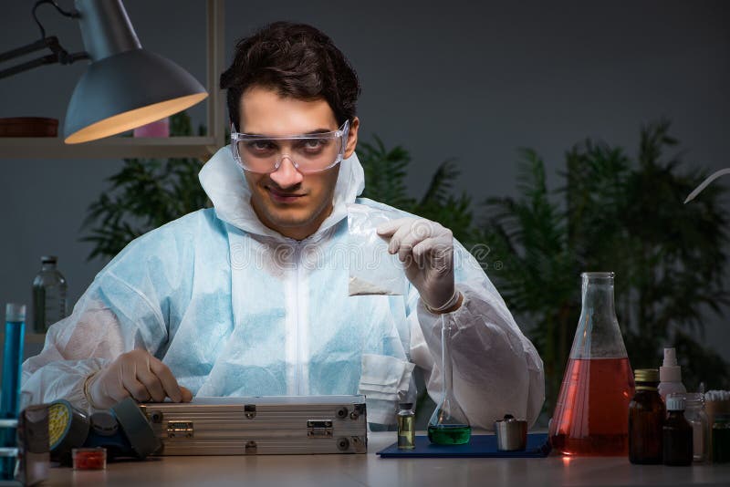 The Forensic Investigator Working in Lab Looking for Evidence Stock ...