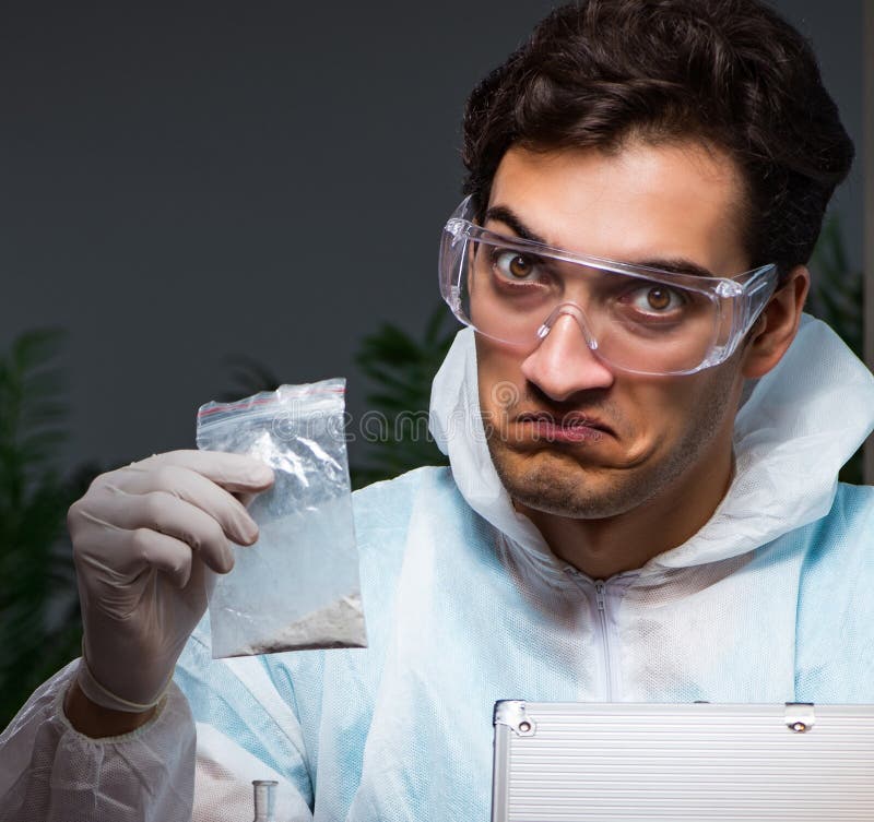 Forensic Investigator Working in Lab Looking for Evidence Stock Photo ...