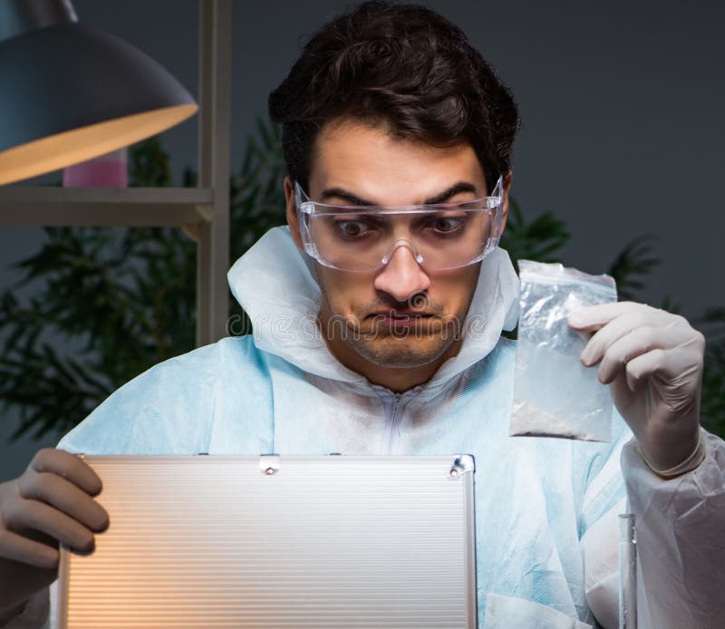 Forensic Investigator Working in Lab Looking for Evidence Stock Image ...
