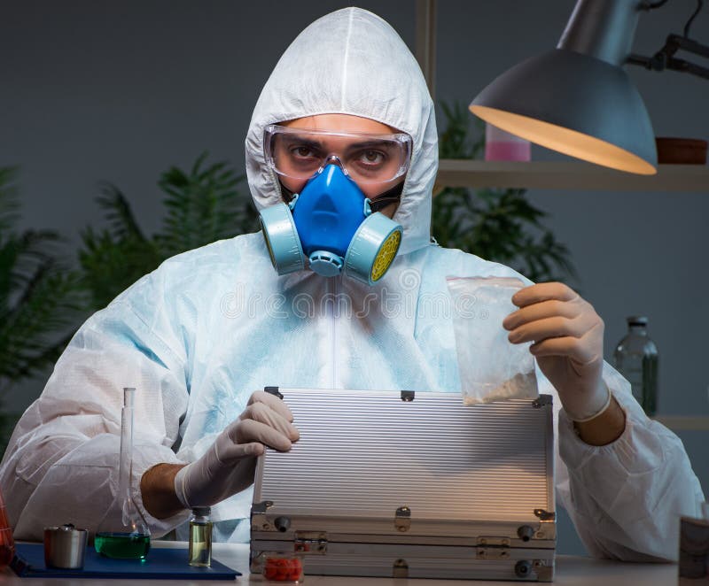 Forensic Investigator Working in Lab Looking for Evidence Stock Photo ...