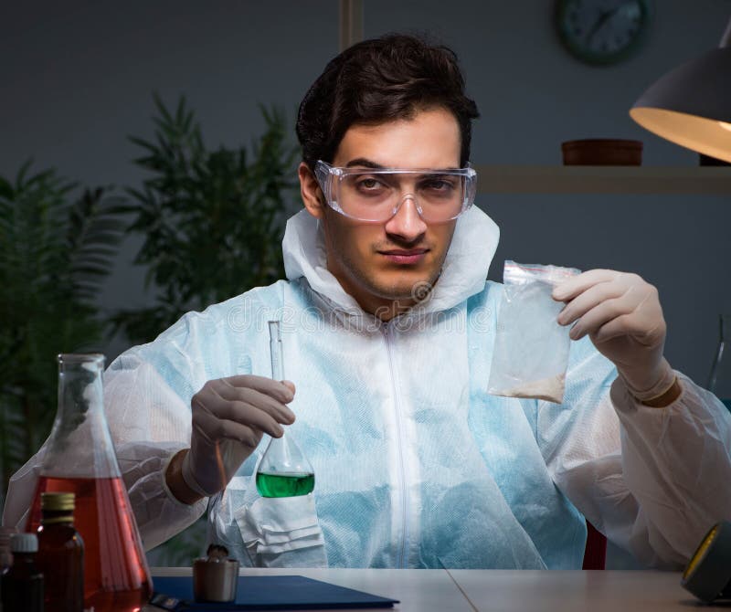 Forensic Investigator Working in Lab Looking for Evidence Stock Photo ...