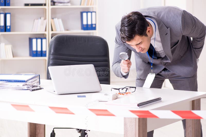 The Forensics Investigator at the Scene of Office Crime Stock Photo ...