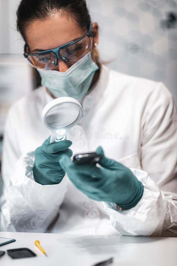 Forensics. Police Expert Examining Evidence Stock Photo - Image of ...