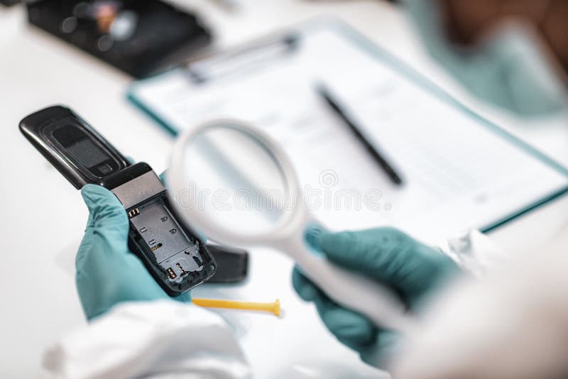 Forensics. Police Expert Examining Evidence Stock Photo - Image of ...
