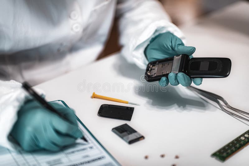 Forensics. Police Expert Examining Evidence Stock Photo - Image of ...