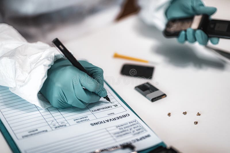 Forensics. Police Expert Examining Confiscated Mobile Phone Stock Image ...