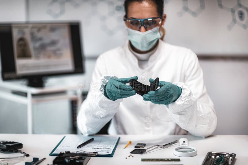 Forensics. Police Expert Examining Evidence Stock Photo - Image of ... Forensics. Police Expert Examining Evidence Stock Photo - Image of ...