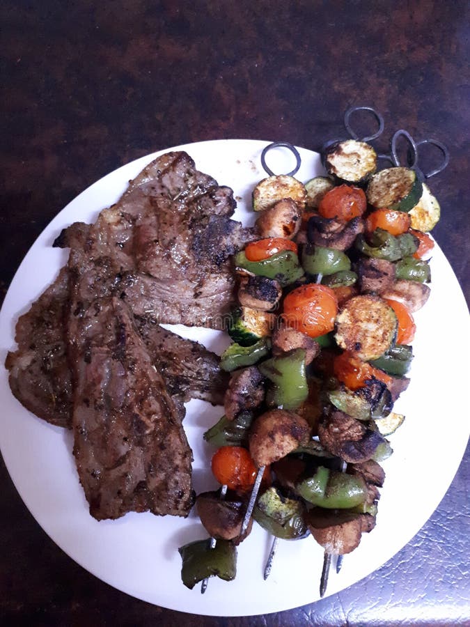 Mediterranean Lamb Chops and Vegetable Skewers Grilled Over a Smokey ...