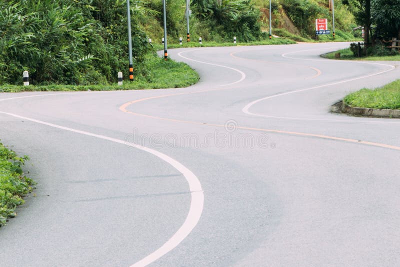 Asphalt winding road stock photo. Image of forward, empty - 141057594