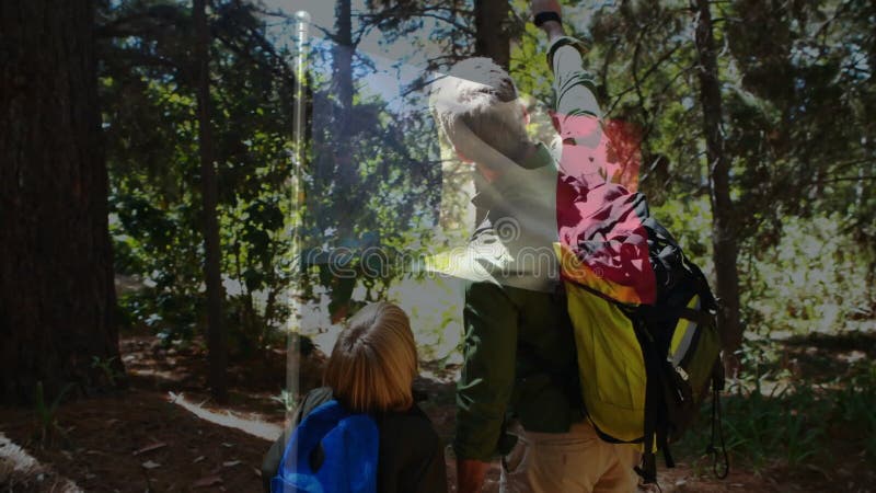 In Forest, Father and Child with Backpacks Pointing at Trees, Exploring ...