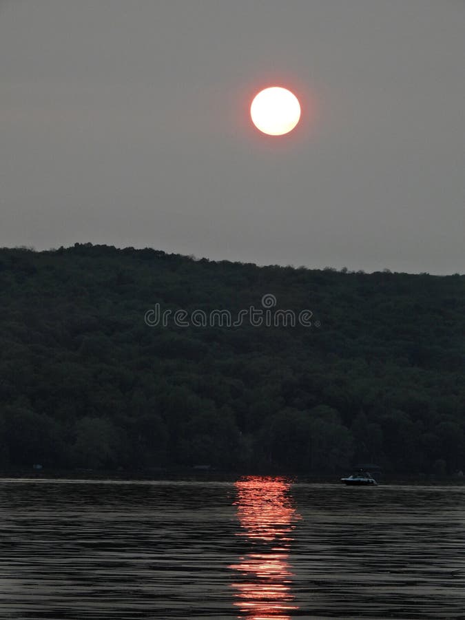 Forest Fire Smoke Creates Orange Sunset on Cayuga Lake Stock Photo ...