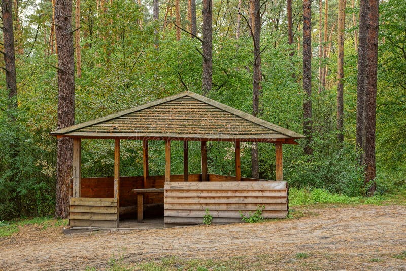 Wooden Brown Arbor on a Clearing in a Pine Forest Stock Image - Image ...