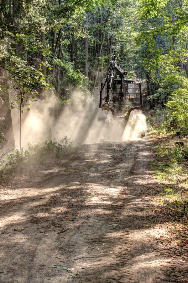 Forest Harvester in the Dust Stock Photo - Image of wood, working: 60850190