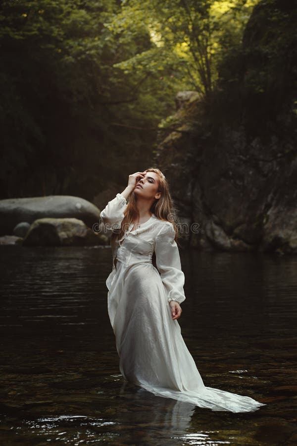 Young woman in fairy pond stock photo. Image of lonely - 90462960
