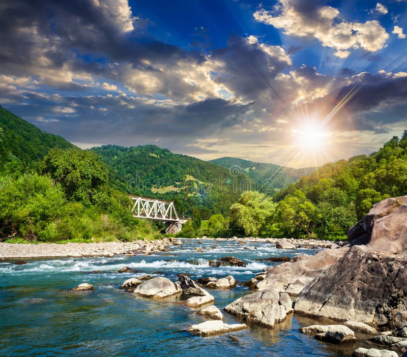 Forest River with Stones and Bridge at Sunset Stock Photo - Image of ...