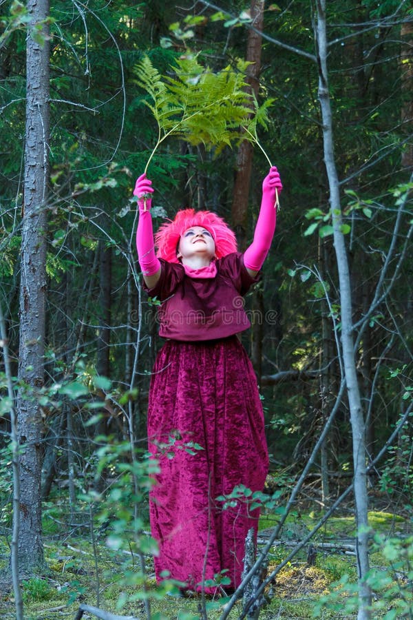 The Forest Witch in Purple Clothes Performs an Magical Ritual with a ...