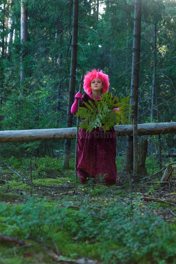 The Forest Witch in Purple Clothes Performs an Magical Ritual with a ...