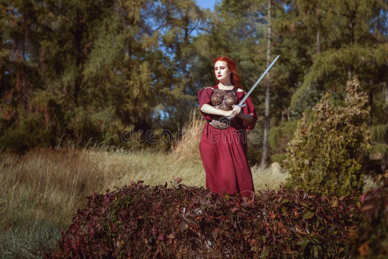 In the Forest, a Woman with a Sword. Stock Photo - Image of females ...
