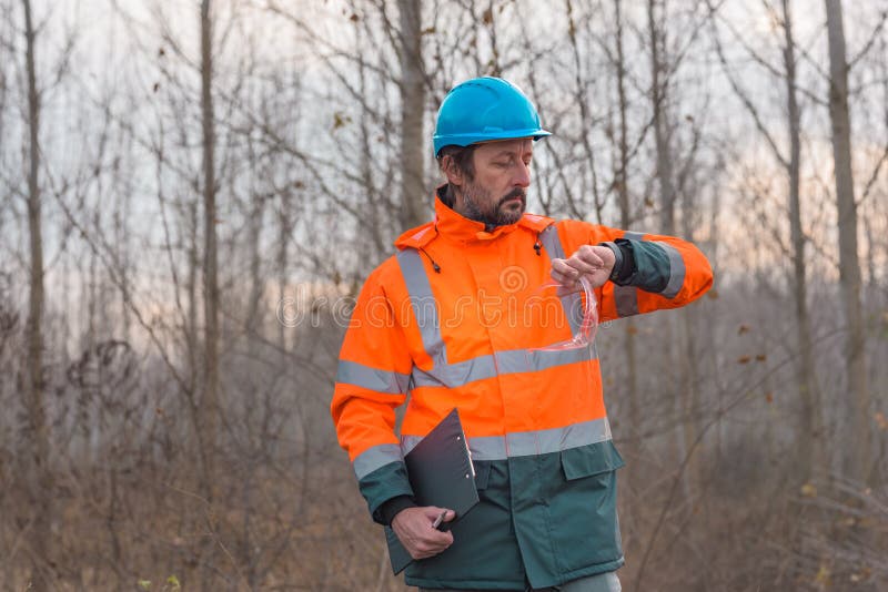 Forestry Technician Checking Up on His Smart Watch Stock Photo - Image ...