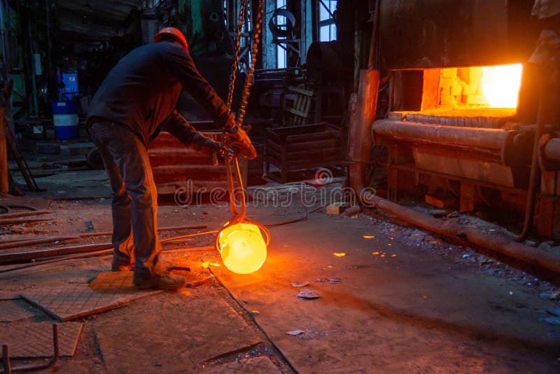 Forge Factory Worker Moving Glowing Hot Metal Workpiece with Chain ...