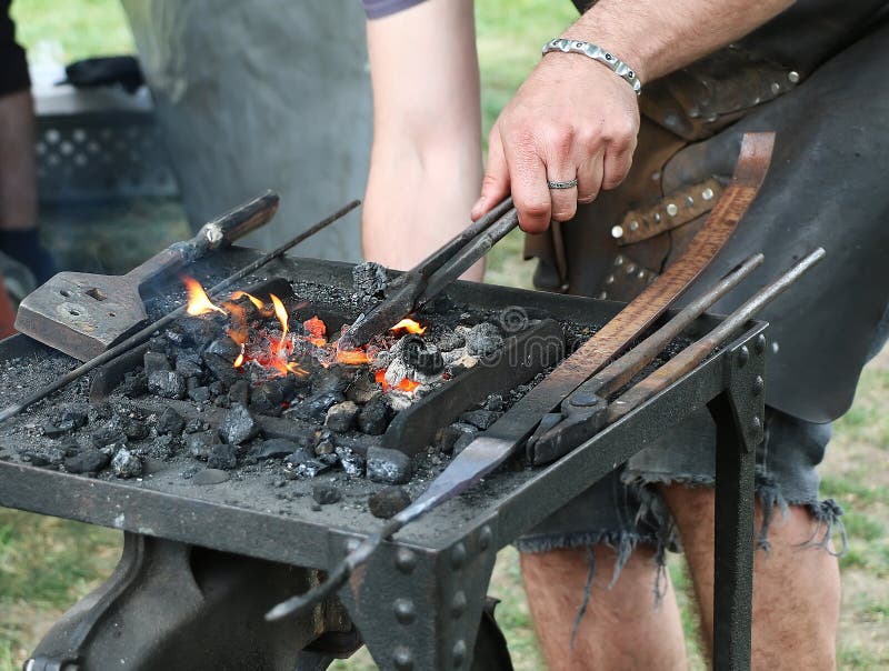Forge, Hands of a Blacksmith Working with Blacksmith Tools, Coal and ... Forge, Hands of a Blacksmith Working with Blacksmith Tools, Coal and ...