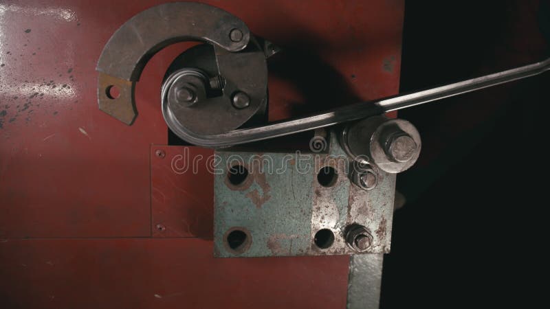 Forge Workshop on Table. Worker Bends the Metal Rod on the Wrought Iron ...